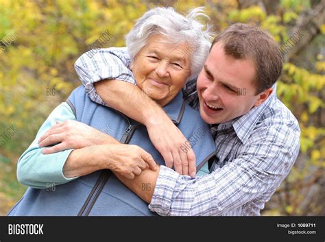Young Man Hugs Elderly Image And Photo Free Trial Bigstock