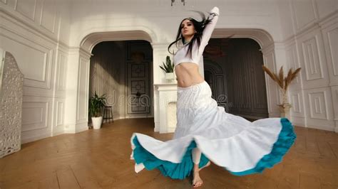 Woman Belly Dancing In Beautiful Eastern Ethnic Oriental Dress Stock