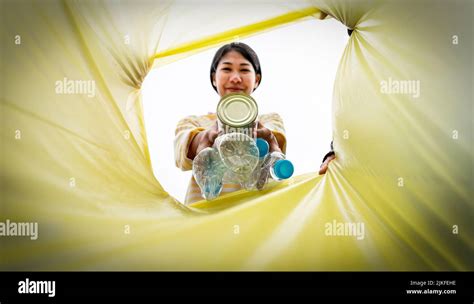 Woman Throws Plastics Trash Garbage Into A Garbage Woman Putting Trash