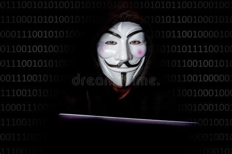 Portrait Of Man With Laptop And Vendetta Mask Isolated On Black