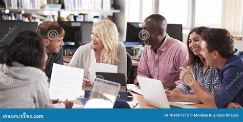 Group Of Mature College Students Collaborating On Project Stock Image