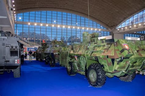 Armored Combat Vehicle Painted In Camouflage Colors At The