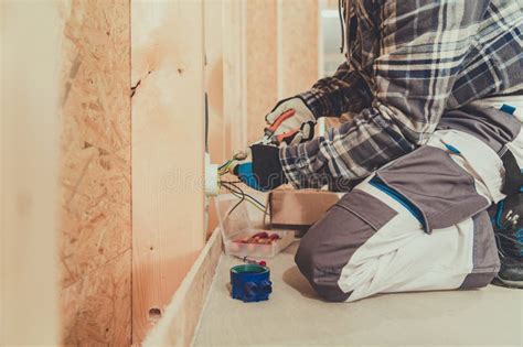 Electrician Performing Wiring Installation In A Residential