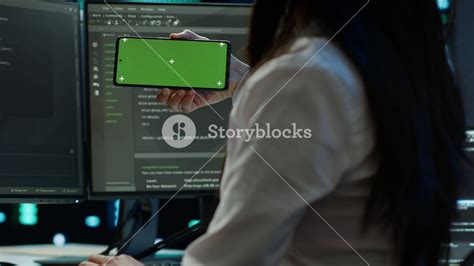 Technician Using Mockup Mobile Phone In Data Center Managing Servers Expert In Server Hub