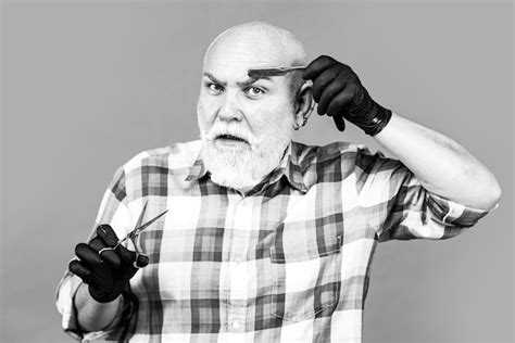 Premium Photo Mature Barber With Scissors And Razor Vintage