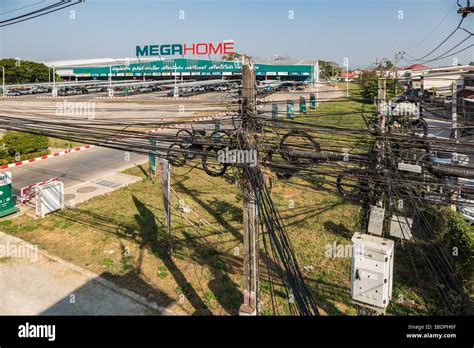 Tangled Mess Of Utility Wires In Front Of The Mega Home Center Building Materials Store In