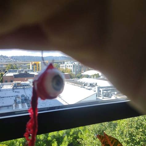 Realistic Human Ripped Out Eyeball On A Hook Ornament Santas