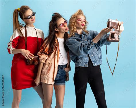 Three Young Girls In Retro 90s Fashion Style Outfits Posing Isolated