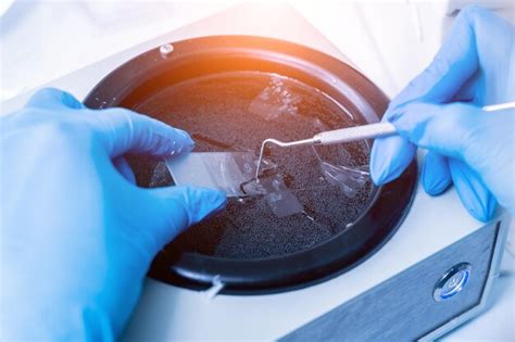 Premium Photo Laboratory Assistant Works On A Rotary Microtome Section And Making Microscope