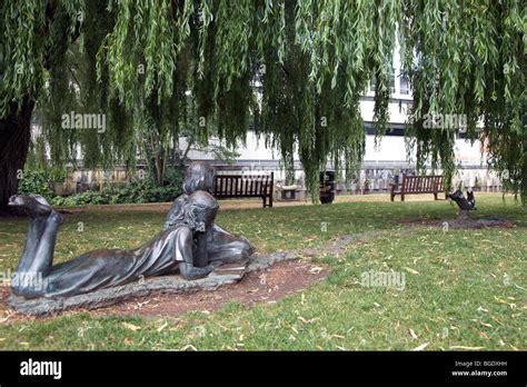 Bronze Statue Of Alice In Wonderland Watching The White Rabbit Run For