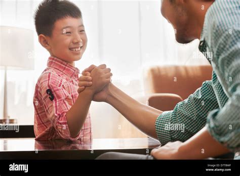 Father And Son Arm Wrestling Stock Photo Alamy