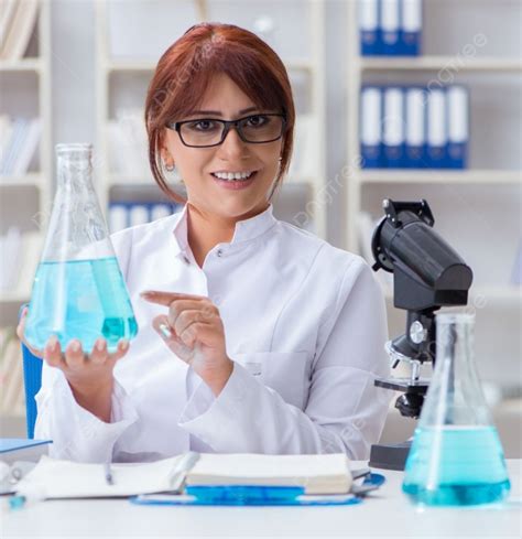 Female Scientist Researcher Conducting An Experiment In A Laboratory