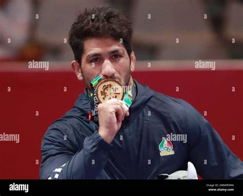 Gold Medals Irans Hassein Noury Poses To Photographer During