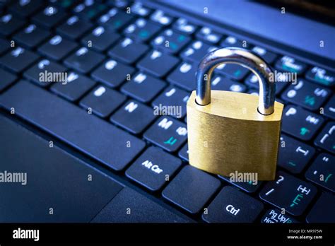 Golden Padlock On Computer Laptop Keyboard With Copy Space Concept Of