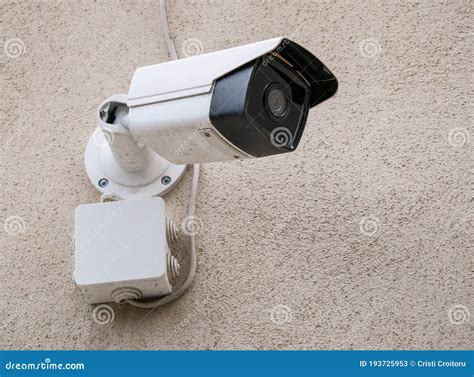 Close Up Surveillance Cctv Camera On Gate Of Construction Site People