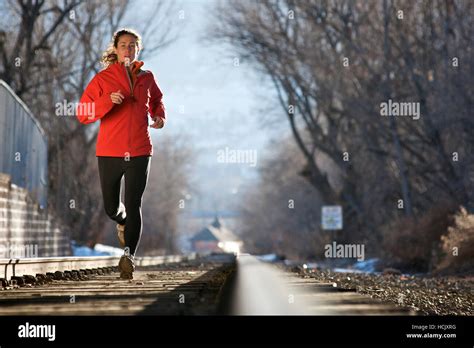 Laura Shultz Taking An Run On A Winter Evening Along The Rail Lines In