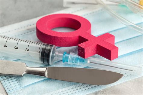 Sex Change Operation Change Of Female To Male Symbol Of A Woman And A Scalpel With A Syringe