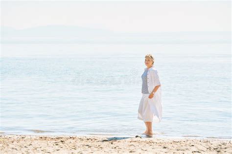 Outdoor Portrait Of Happy And Healthy Mature 50 55 Year Old Woman