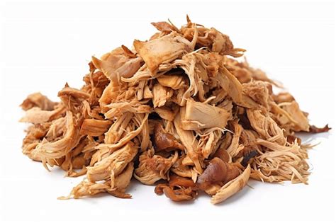 Premium Photo A Pile Of Shredded Chicken On A White Background