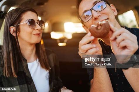 Eating Donut Car Photos And Premium High Res Pictures Getty Images