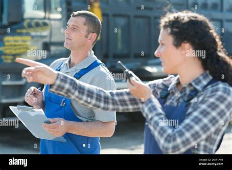 Workers Giving Instruction Through Walkie Talkie Stock Photo Alamy