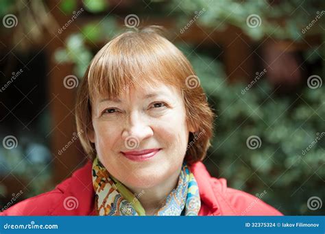 Portrait Of Smiling Mature Woman Stock Photo Image Of Field