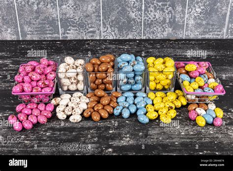 Heap Of Sugared Almonds And Hazelnuts Dragees In Chocolate Isolated On