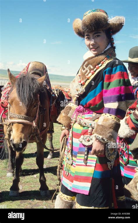 Tibetan Girl Rider In A Fur Hat And Traditional Costume At Naqu Nagqu