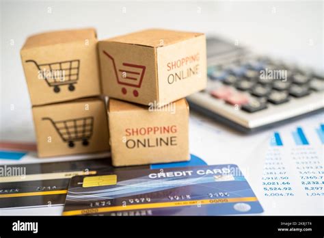 Shopping Online Box With Credit Card And Calculator On Graph Finance