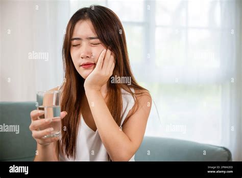 Beautiful Female Toothache And Dental Problems Touching Cheek Feeling
