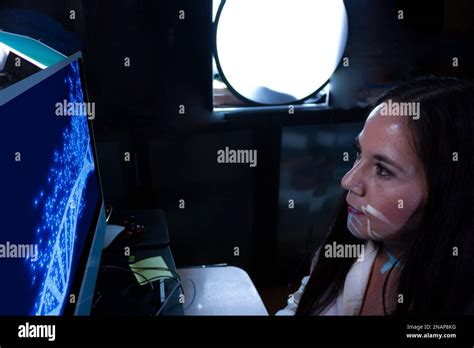 Woman Doctor Works On Human Dna Analysis With Computer Simulation Aids