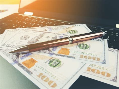 Premium Photo Business Report Chart And Financial Graph Analysis With Dollar Money And Pen On