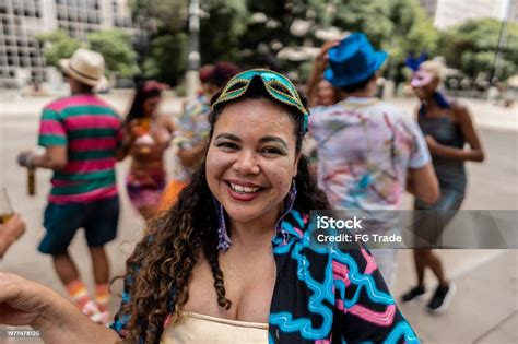 Portrait Of A Mid Adult Woman Having Fun At A Street Carnival Party