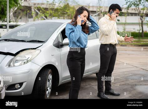 Two Drivers Call Insurance After A Car Accident Before Taking Pictures