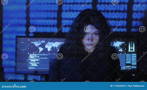 Woman Hacker Programmer With Curly Hair Is Working On Computer In Cyber