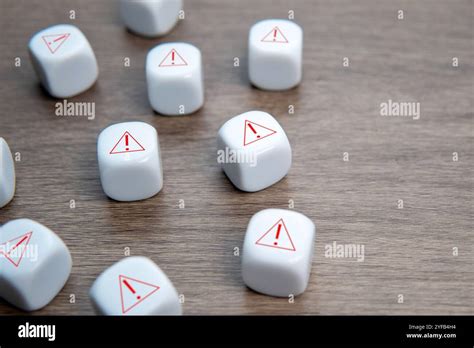 A Group Of White Dice With Red Exclamation Marks Warning Urgency Alert And Attention Concept