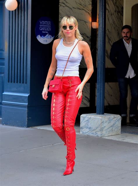 Braless Miley Cyrus Is Red Hot In Leather Lace Up Biker Pants With A
