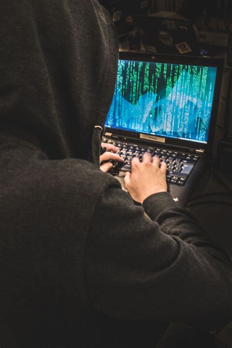Hooded Computer Hacker Stealing Information With Laptop Artofit