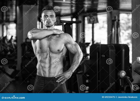 Muscular Men Flexing Muscles In Gym Stock Image Image Of Modern Black 69233475