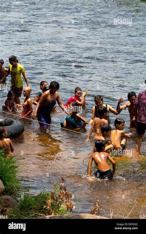 Local People Taking A Bath In The River At The Teuk Chhou Rapids In The