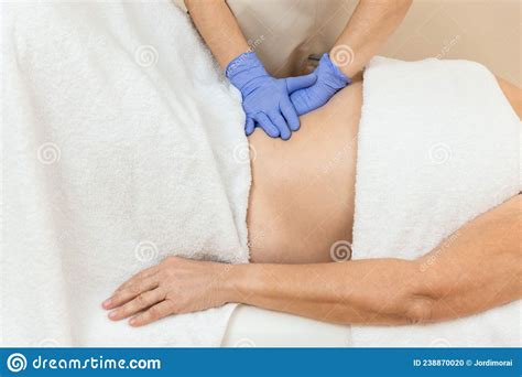 Side View Of A Physiotherapist Checking Diastasis Recti On Belly Of