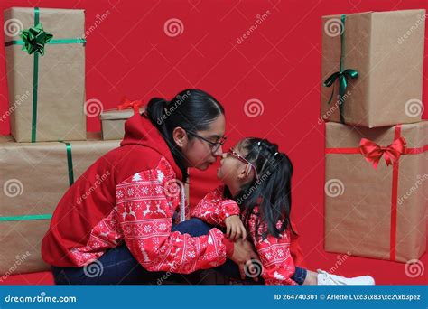 Latina Mom And Daughter With Glasses Wear Ugly Christmas Sweaters And