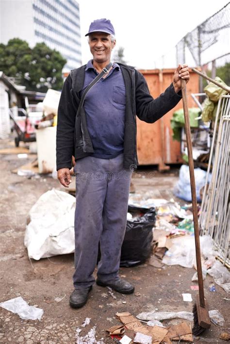 Treasure Hunting At The Dump A Man Sorting Through Garbage At A