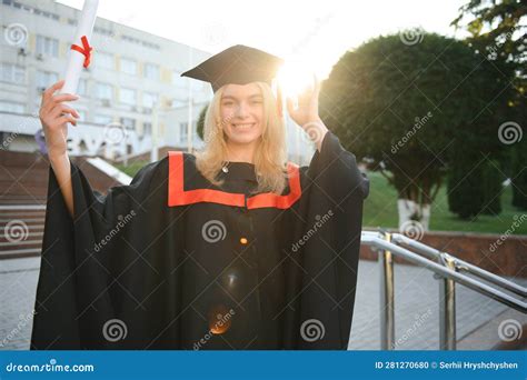 Portrait Enthusiastic Female College Student Graduate In Cap And Gown