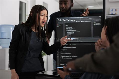 Diverse Software Developers Analyzing Html Code And Database Editorial