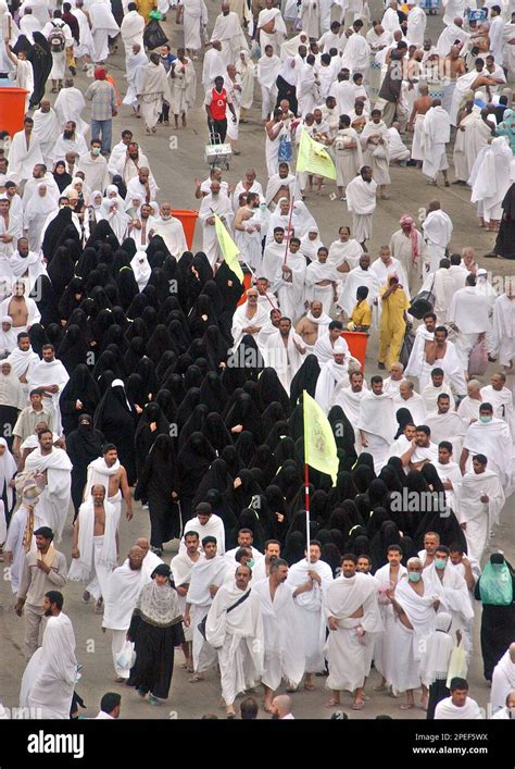 Female Pilgrims Are Guarded By Men After Throwing Pebbals At Pillars
