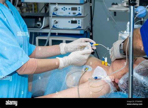 Anesthesiologists Administer General Anesthesia To A Patient On The