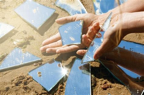 Premium Photo Female Hands And Lot Of Broken Mirror Shards