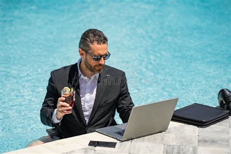 Summer Business Funny Businessman In Suit With Laptop In Swimming Pool