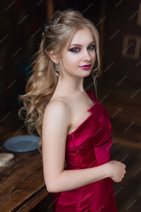 Premium Photo Sensual Beautiful Blonde Woman Posing In Red Dress